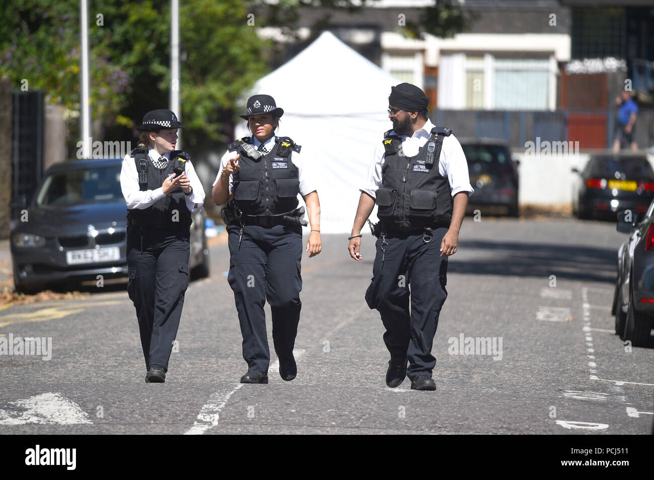 Police officers in Warham Street in Camberwell, south London, where ...