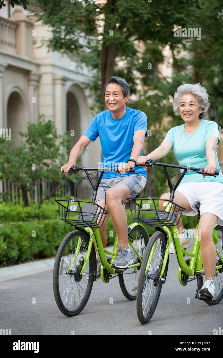 Chinese women riding bicycle hi-res stock photography and images - Alamy