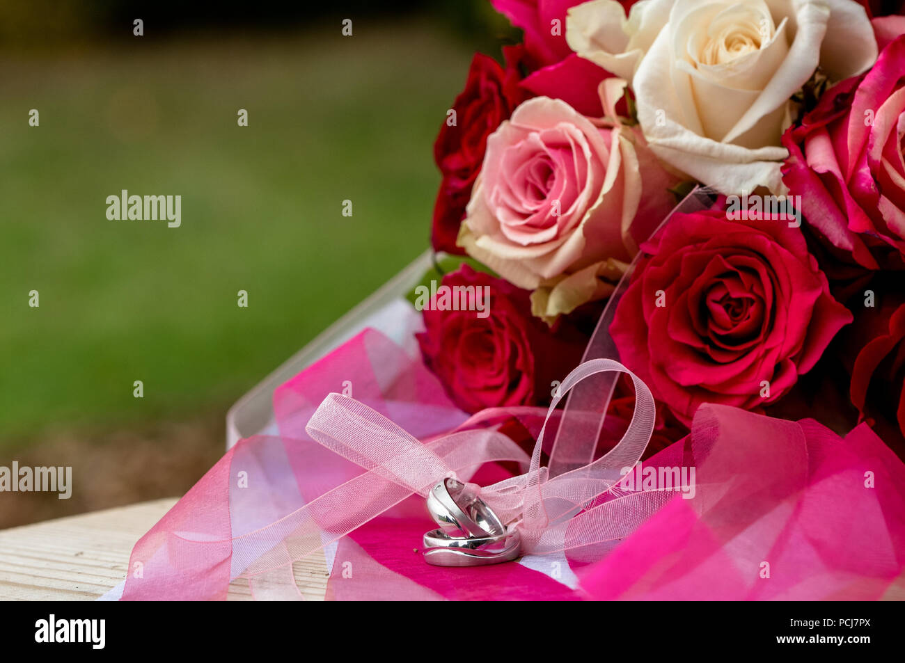 Wedding decoration and flowers with wedding rings Stock Photo - Alamy