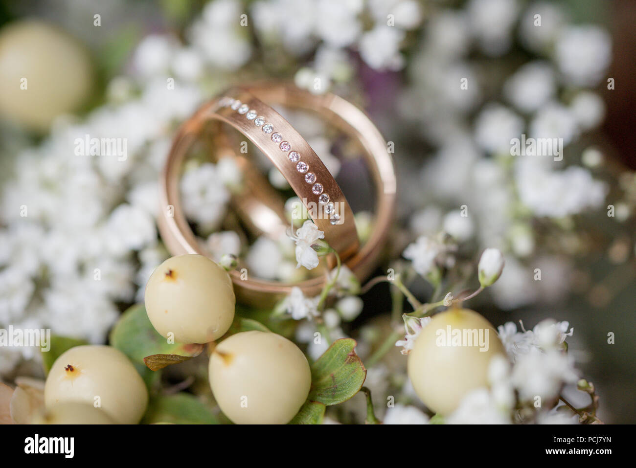 Wedding decoration and flowers with wedding rings Stock Photo - Alamy