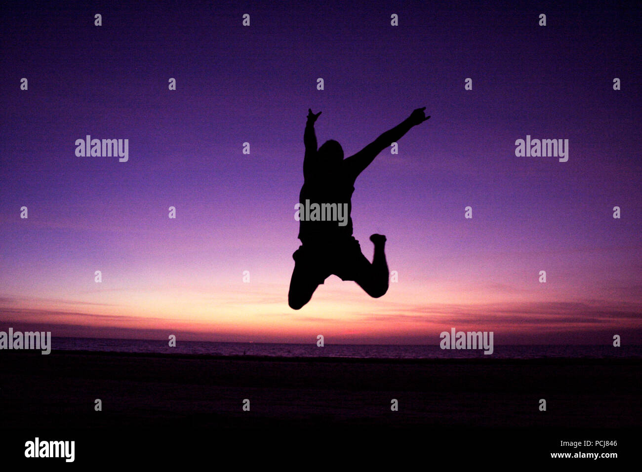 Silhouette man jumping happy victory hi-res stock photography and ...