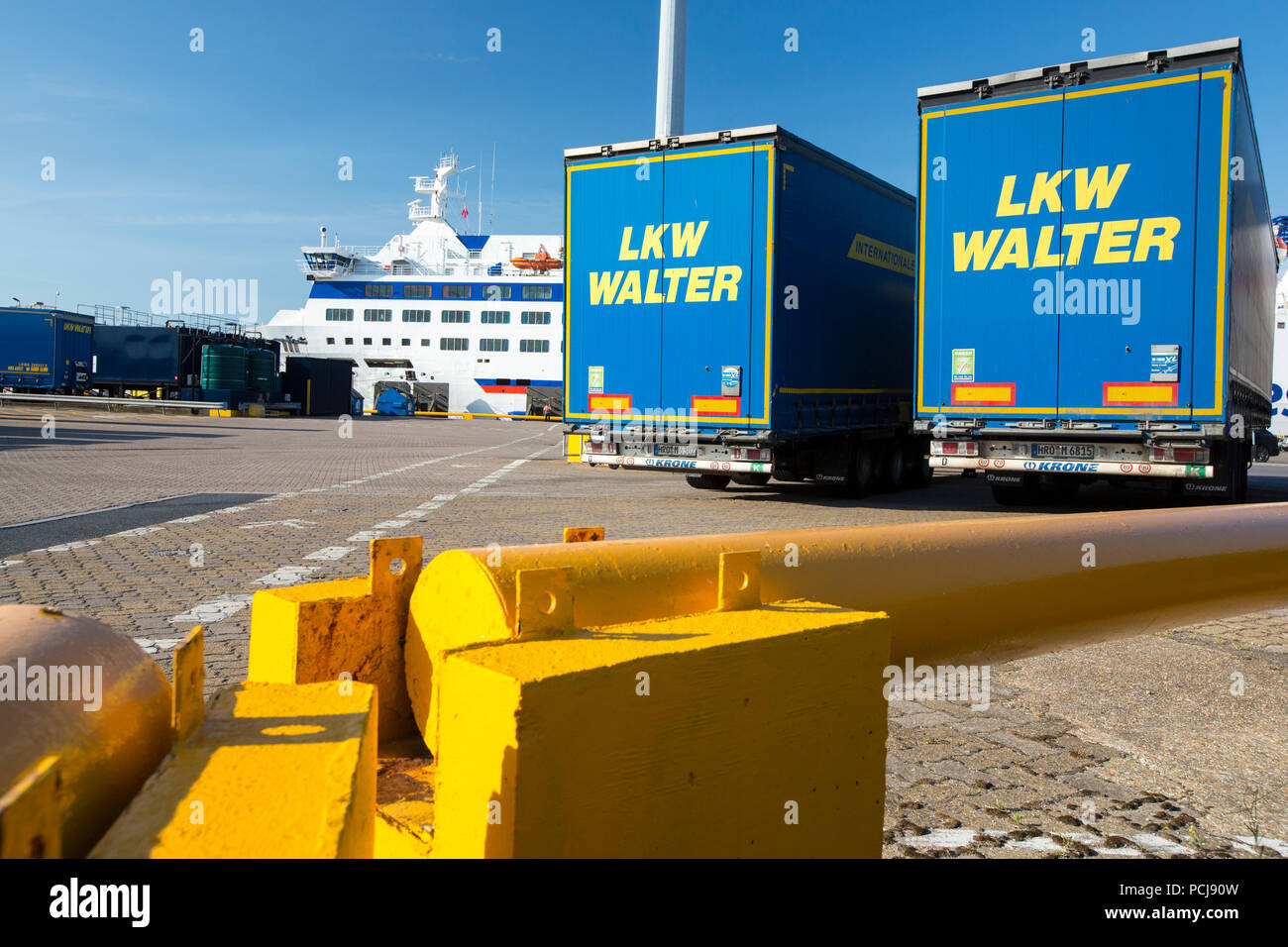 Poole ferry terminal with lorries parked up and a croos channel ferry ...