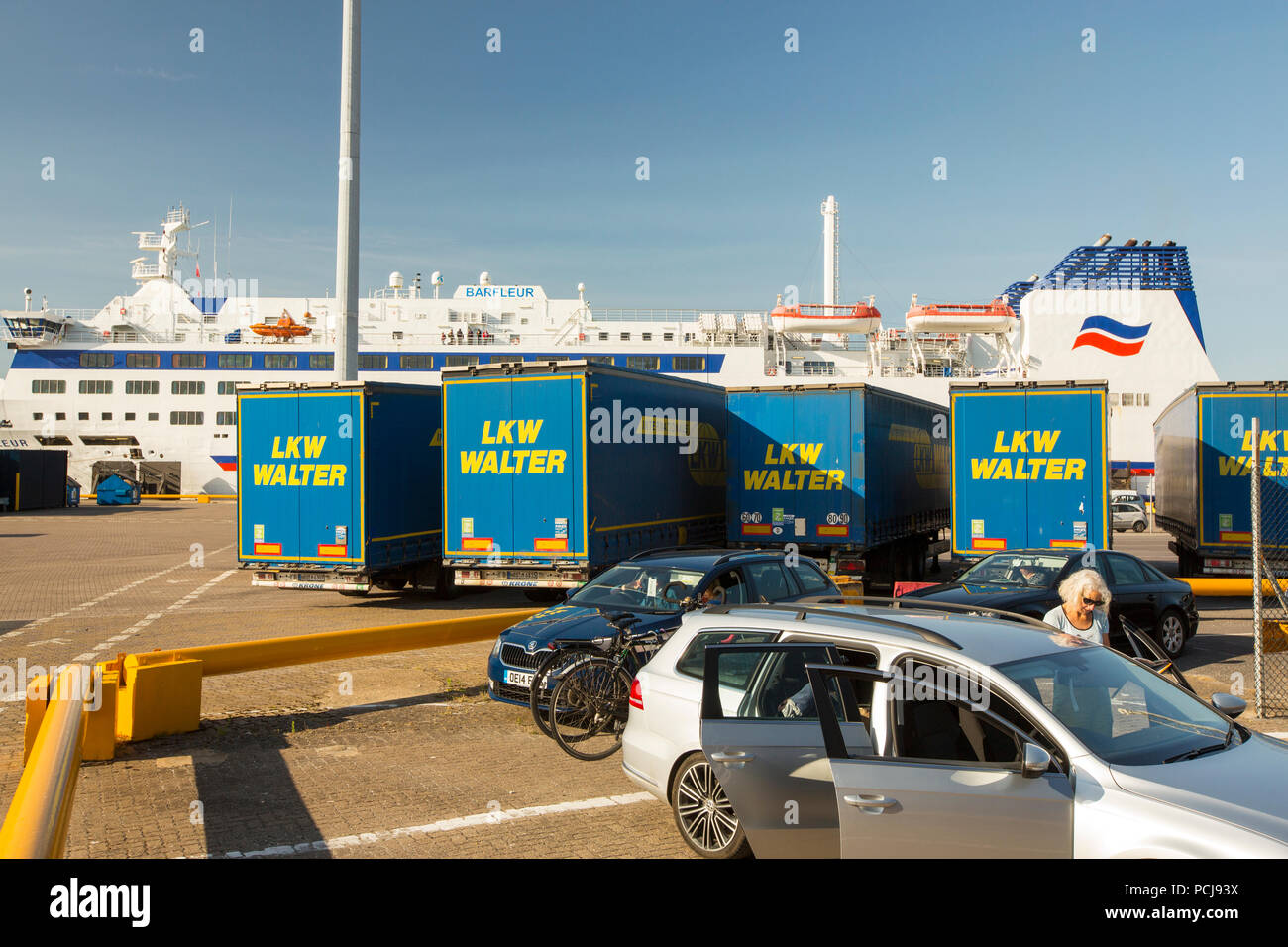 Poole ferry terminal with lorries parked up and passengers queing for a ...