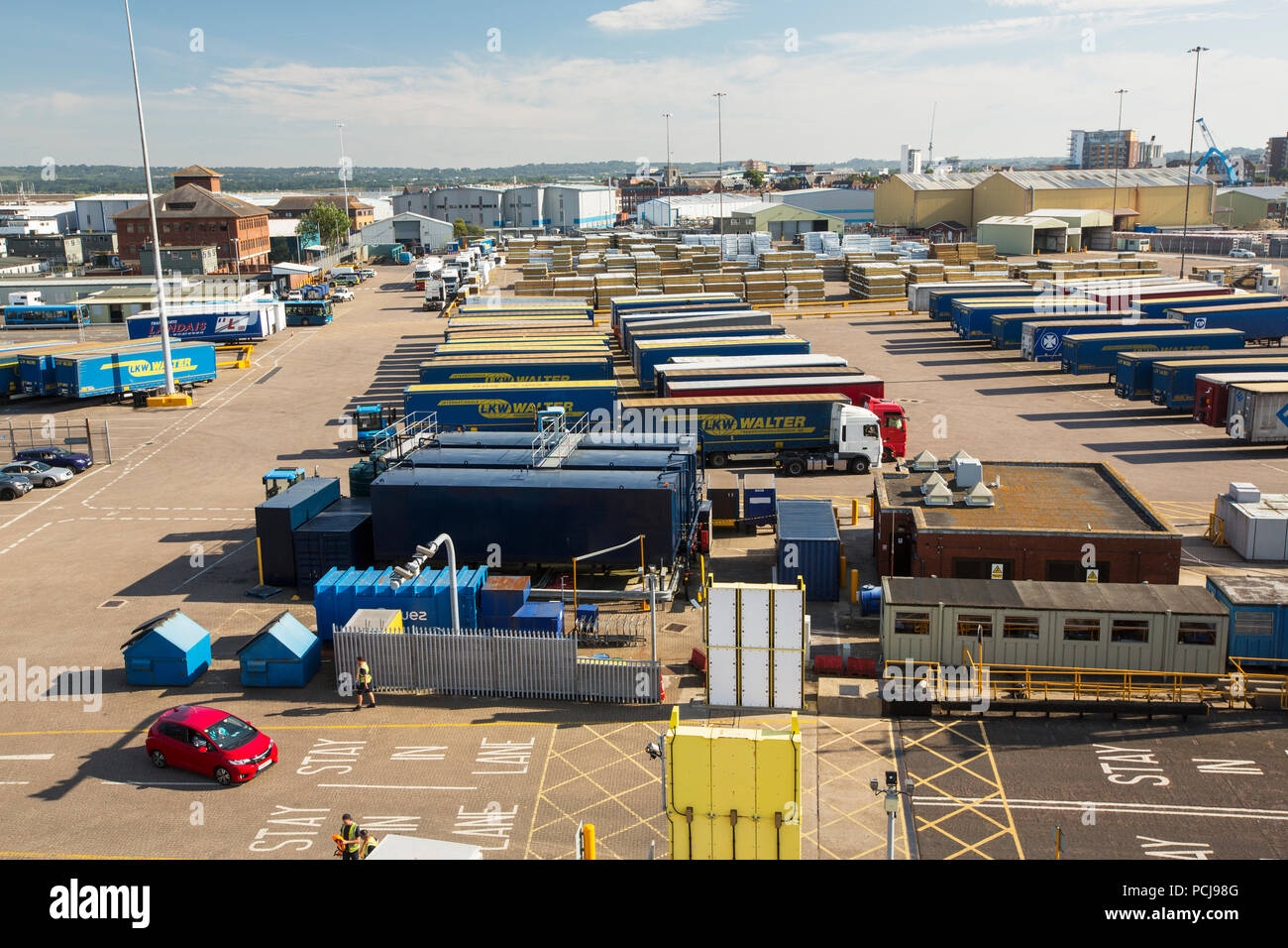 Poole ferry terminal with lorries parked up and passengers queing for a ...