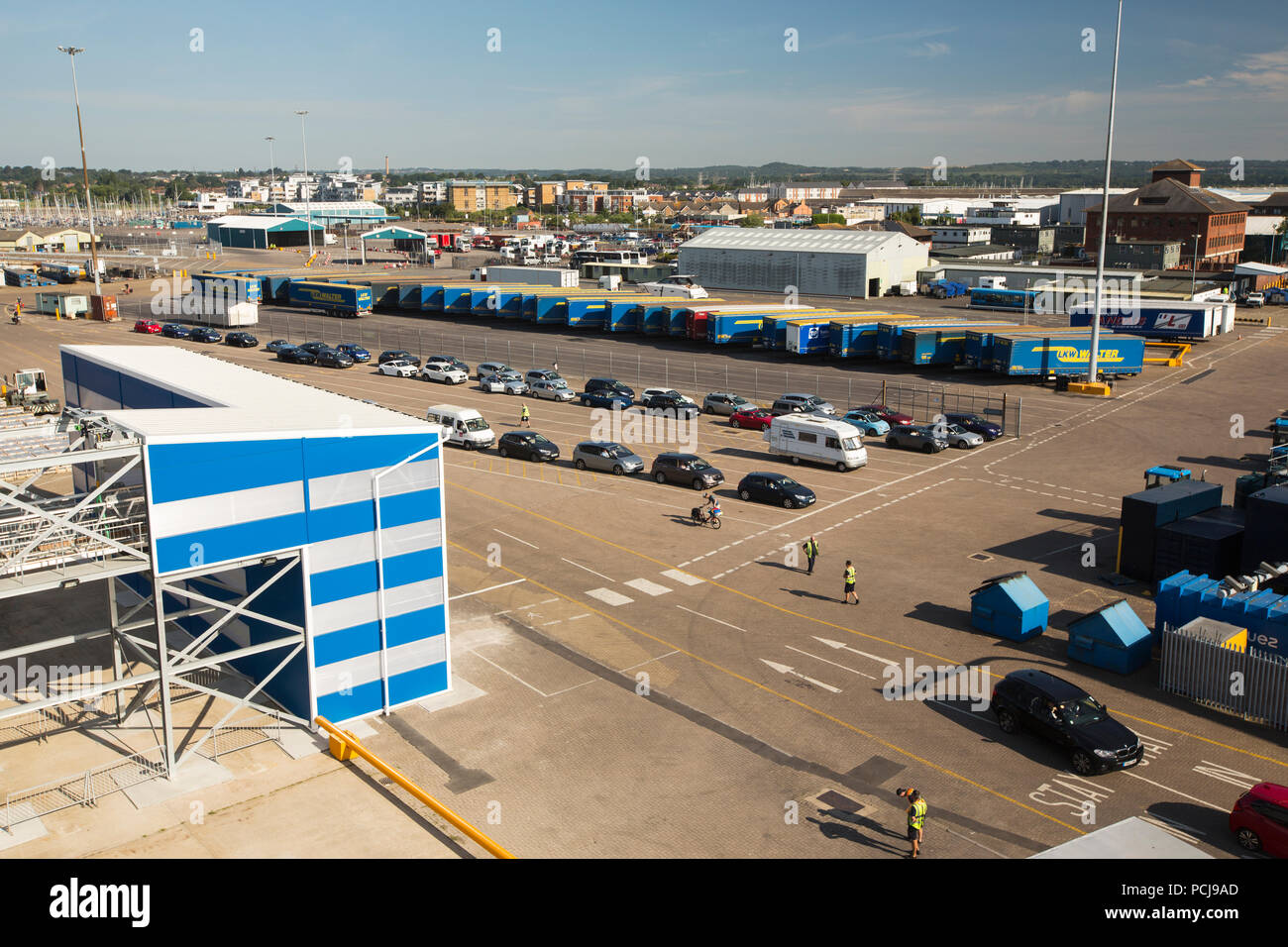Poole ferry terminal with lorries parked up and passengers queing for a ...
