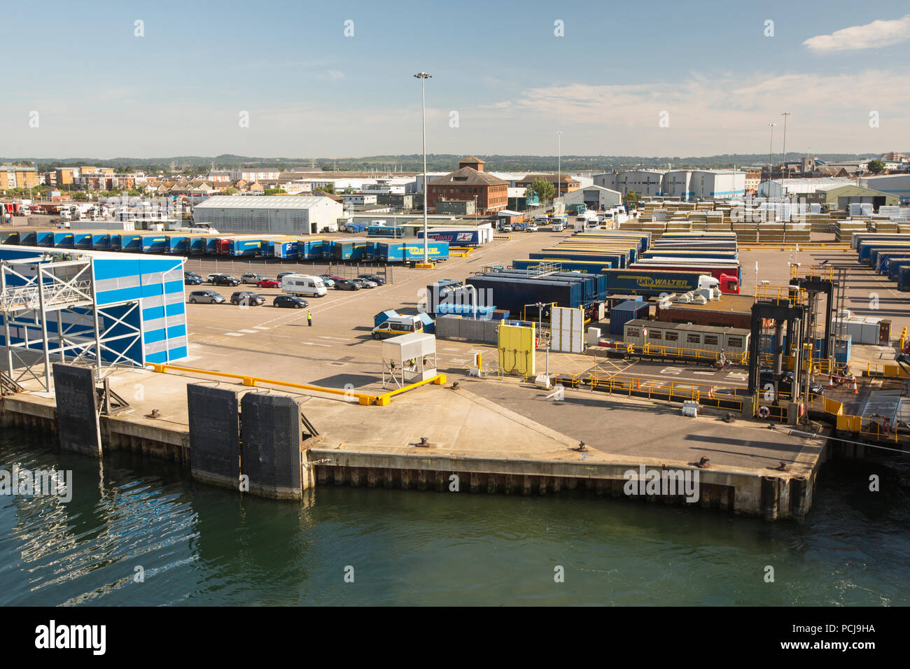 Poole ferry terminal with lorries parked up and passengers queing for a ...