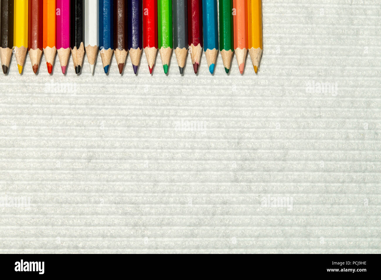 White background with colored pencils Stock Photo - Alamy