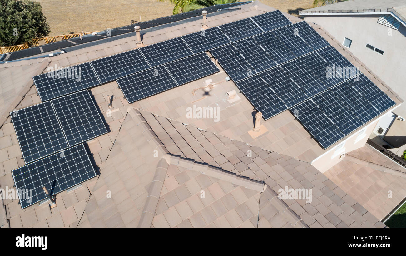 Solar Panels Installed on Roof of Large House Stock Photo - Alamy