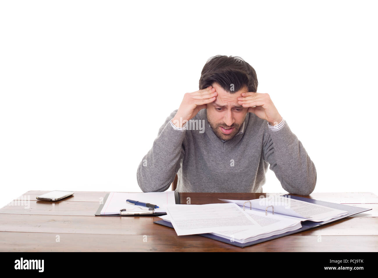 worried man working on a desk, isolated on white background Stock Photo ...