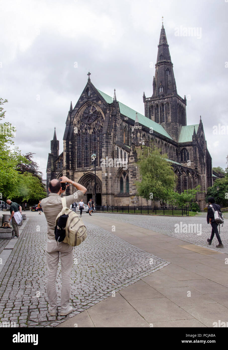 GLASGOW, SCOTLAND - AUGUST 2nd 2018: A tourist taking a photograph of ...