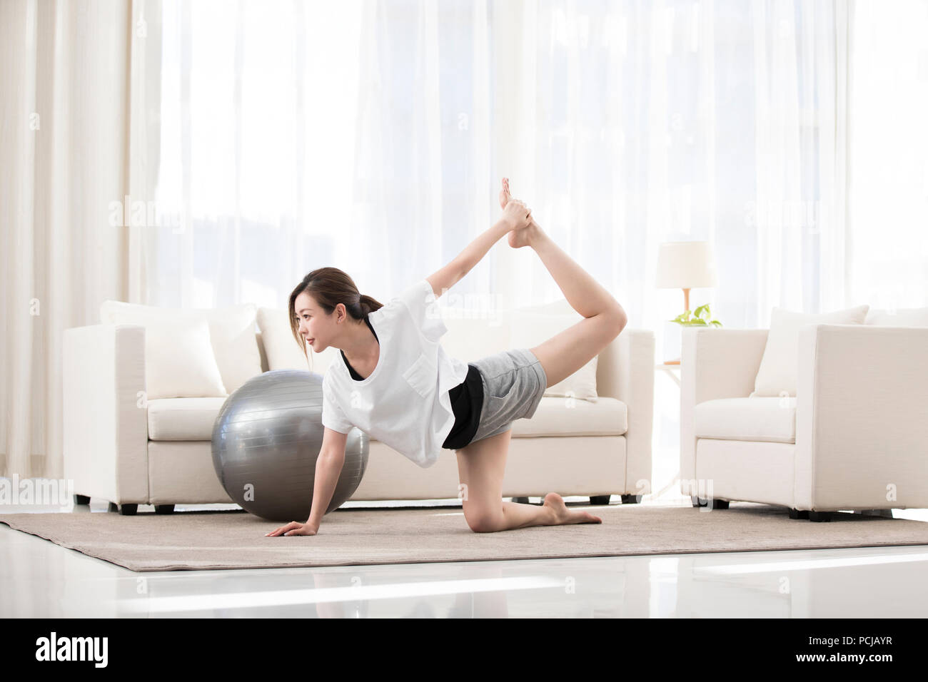 Chinese woman lying on exercise hi-res stock photography and images - Alamy