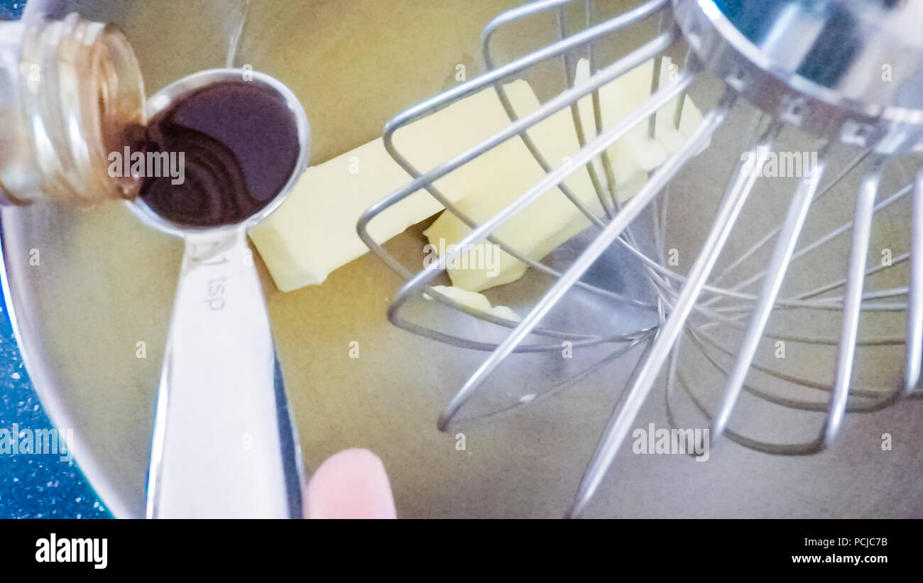 Step by step. Mixing ingredients in kitchen mixer to make vanilla ...