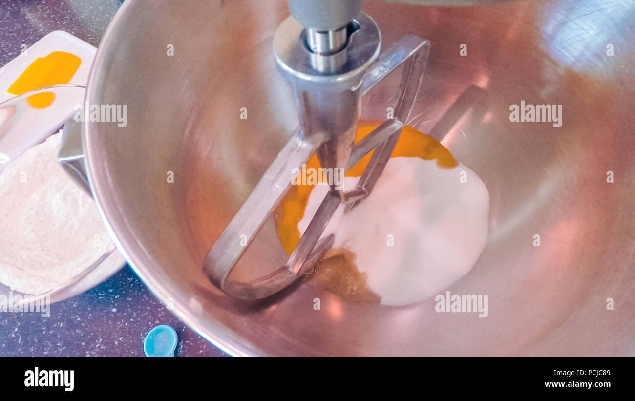 Step by step. Mixing ingredients in kitchen mixer to make vanilla ...