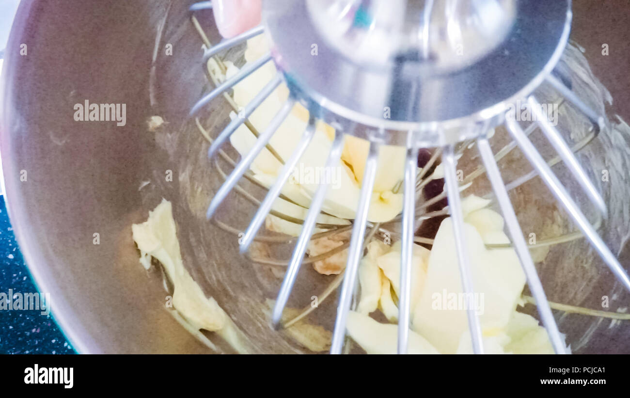 Step by step. Mixing ingredients in kitchen mixer to make vanilla ...