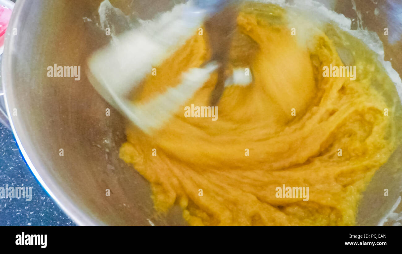 Step by step. Mixing ingredients in kitchen mixer to make vanilla ...