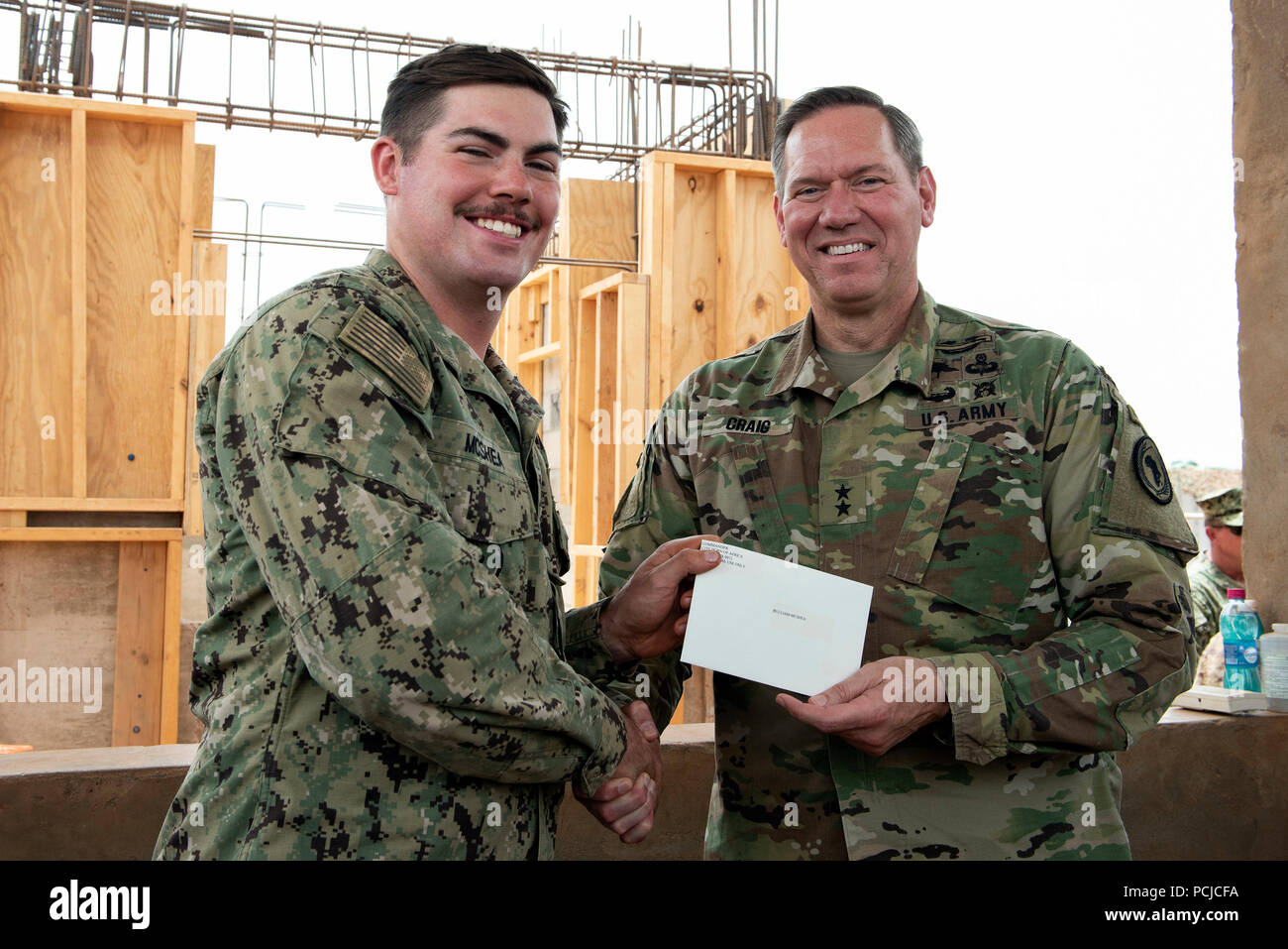 U.S. Navy Builder Petty Officer 2nd Class Liam McShea, project crew ...