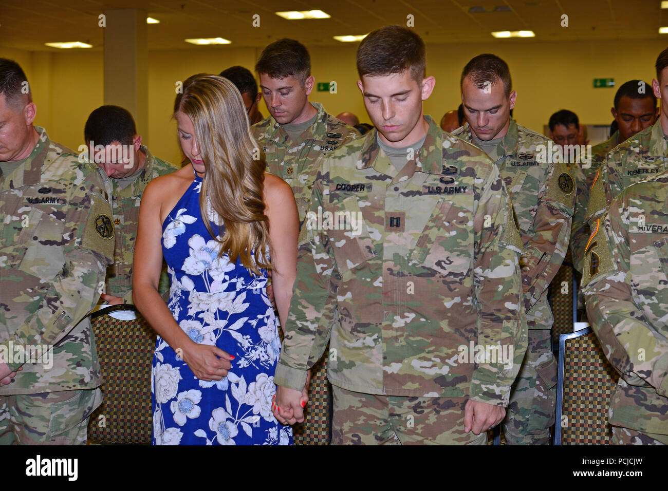 U.S. Army Capt. Jesse R. Cooper, incoming commander, and his wife bow ...