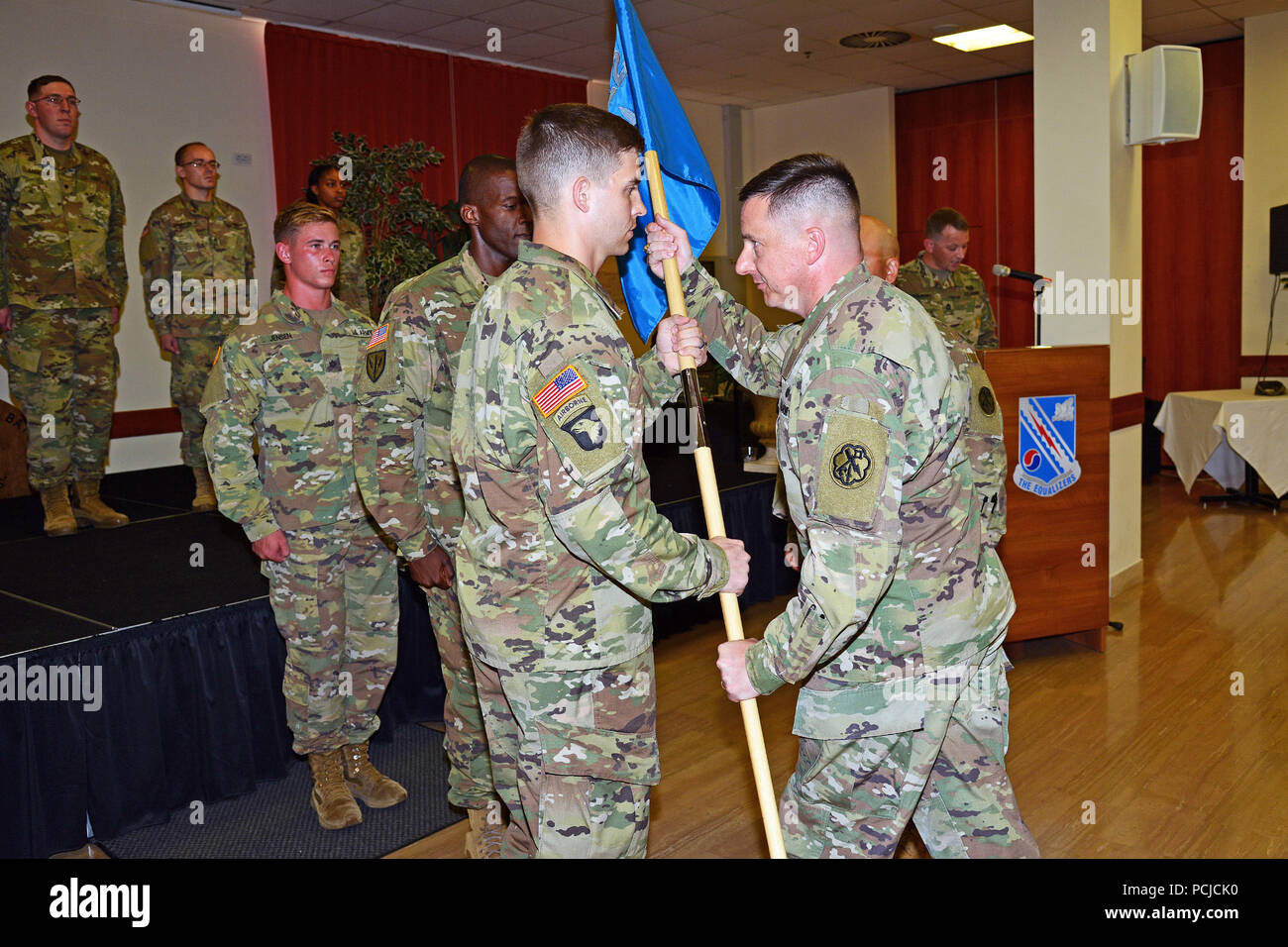U.S. Army Capt. Jesse R. Cooper (left), incoming commander, receives ...