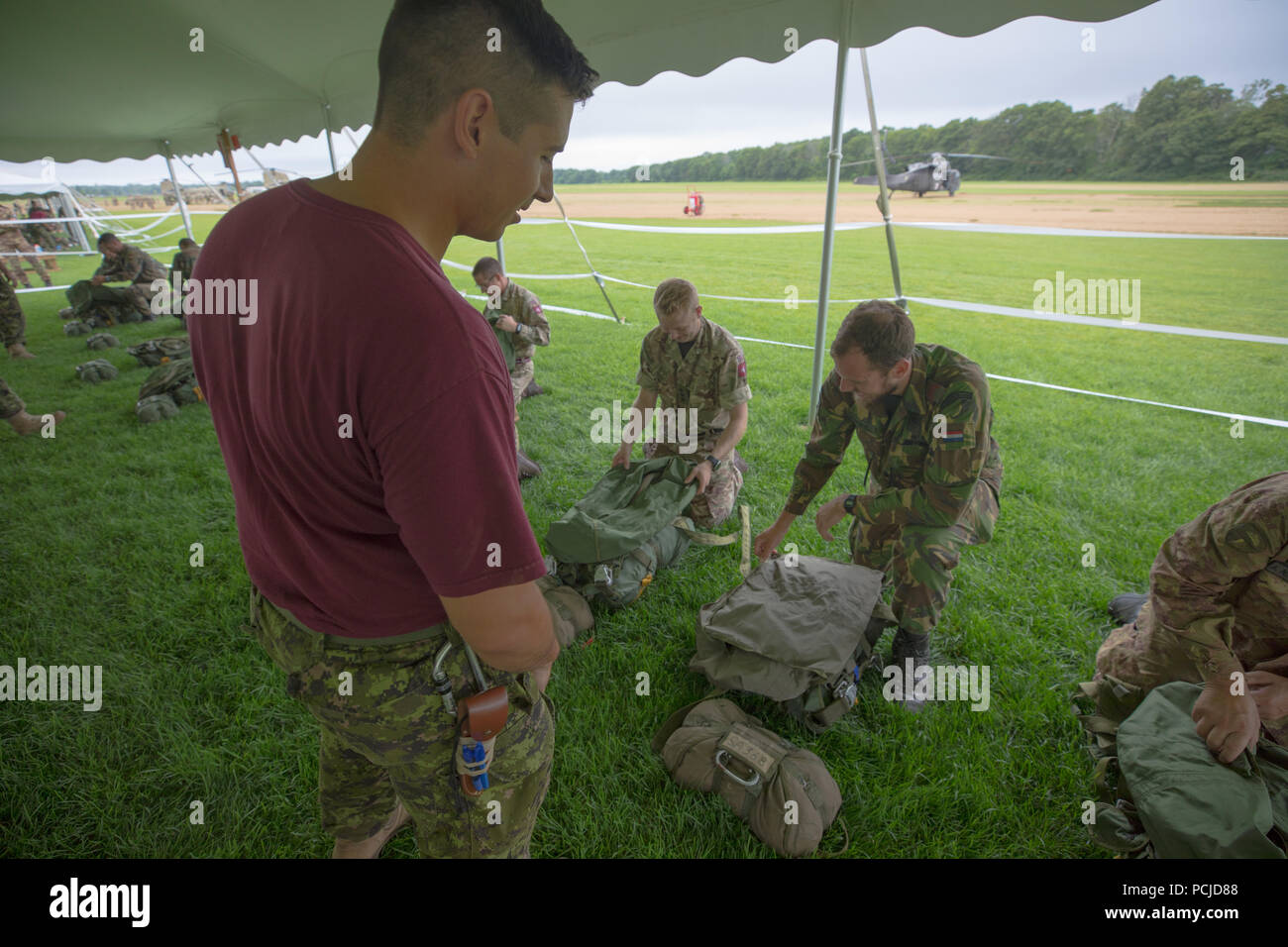 A Canadian Jumpmaster gives instructions on the operations of an MC-1 ...