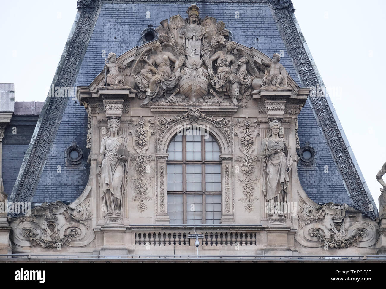 Architectural fragments of Louvre building. Louvre Museum is one of the ...