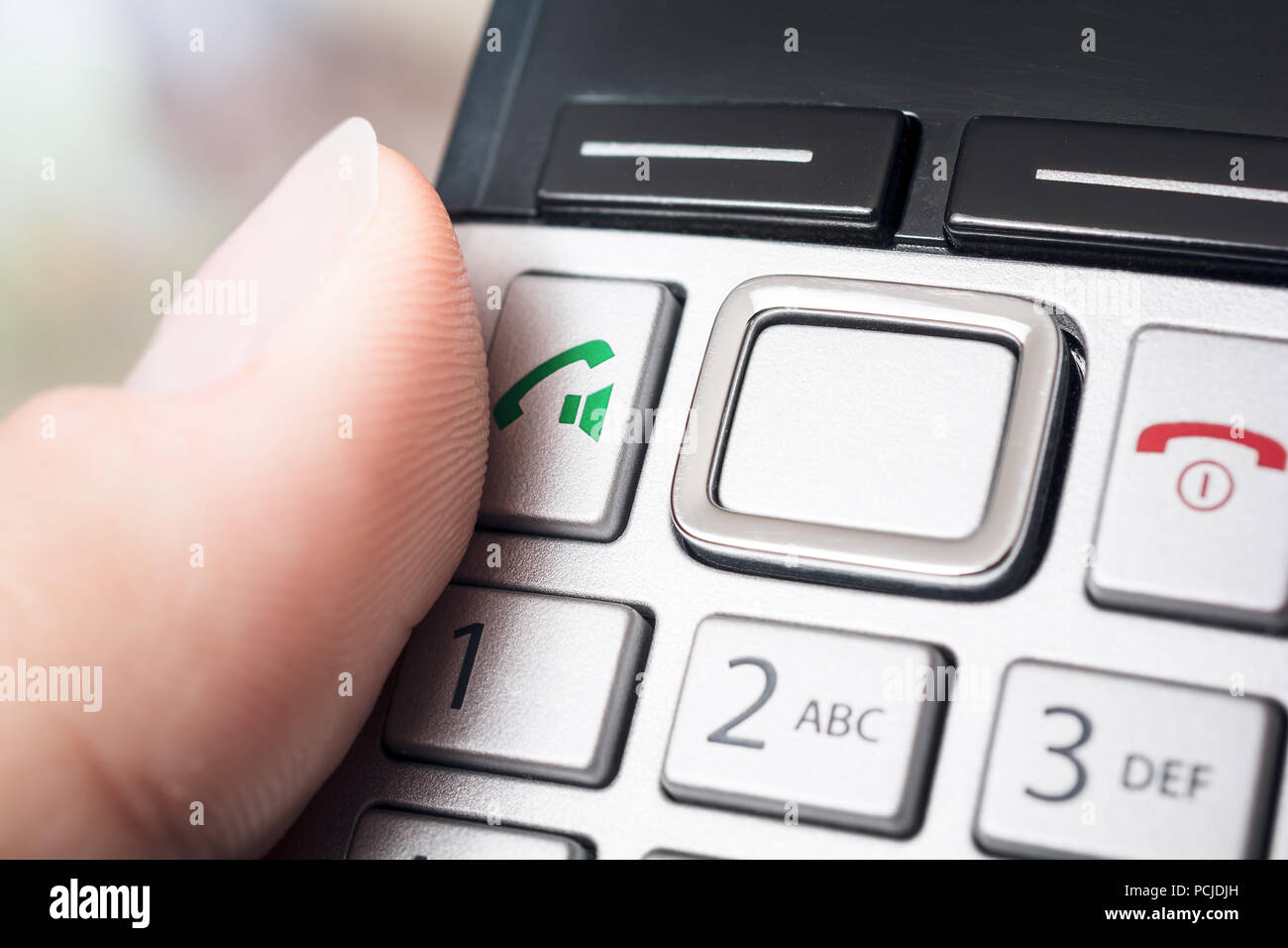 Male Finger On The Call Button Of A Wireless DECT Telefphone, Ready To ...