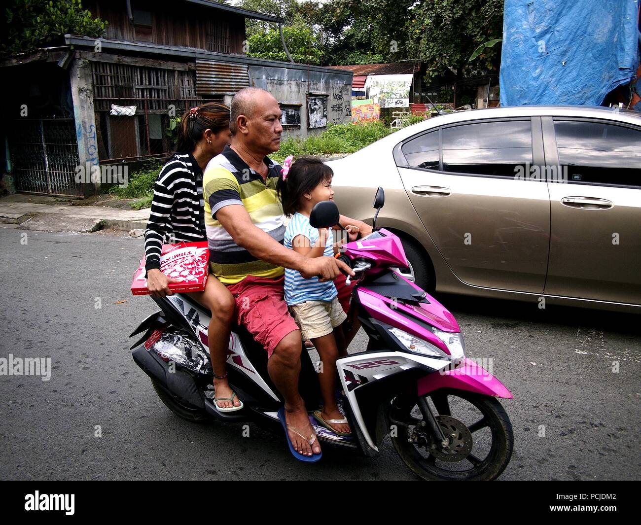 ANTIPOLO CITY, PHILIPPINES - AUGUST 1, 2018: A motorcycle rider and his ...