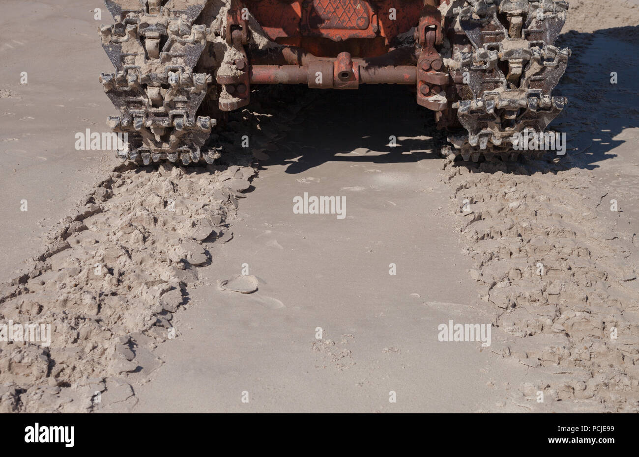 Tractor on the sand, coastline of Baltic sea Stock Photo - Alamy