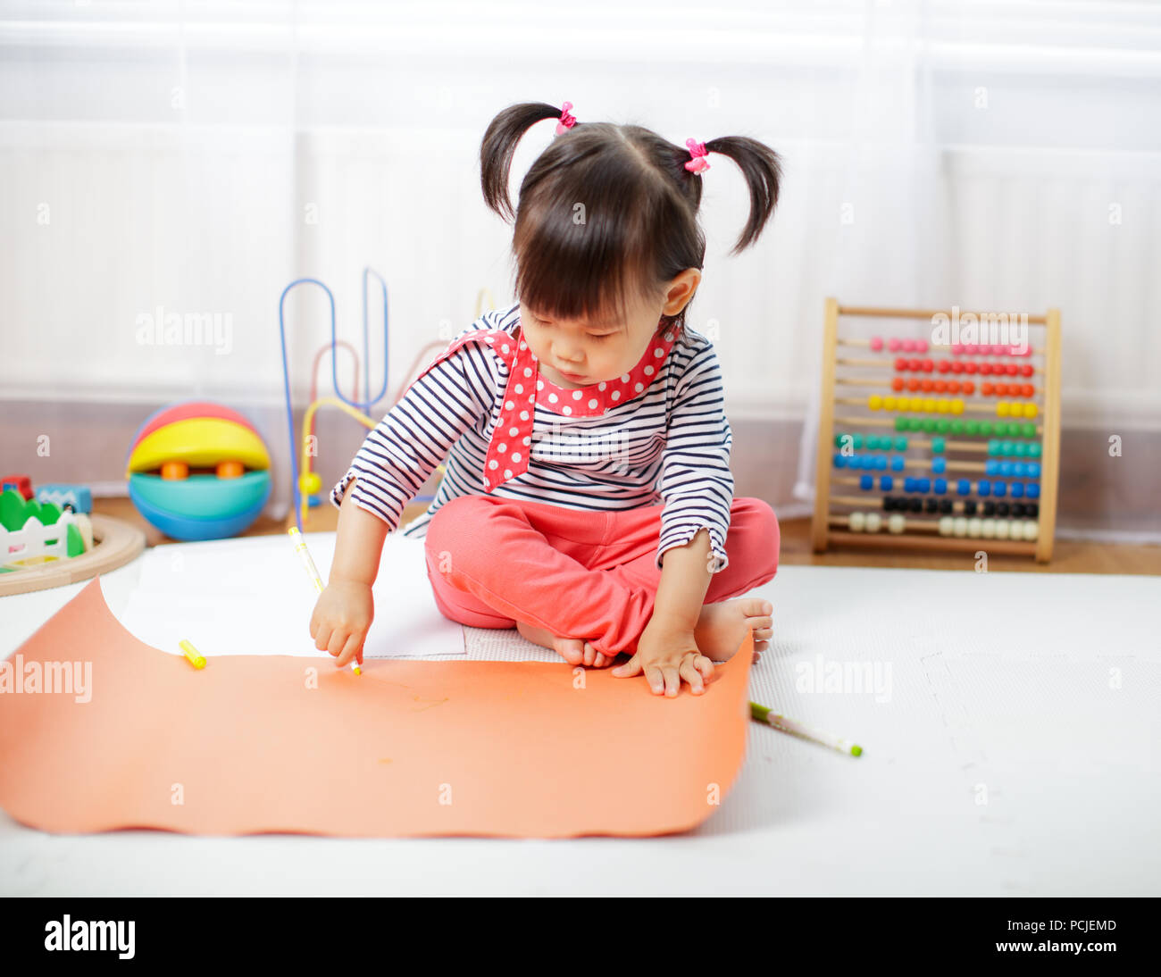 baby girl learning draw at home Stock Photo - Alamy