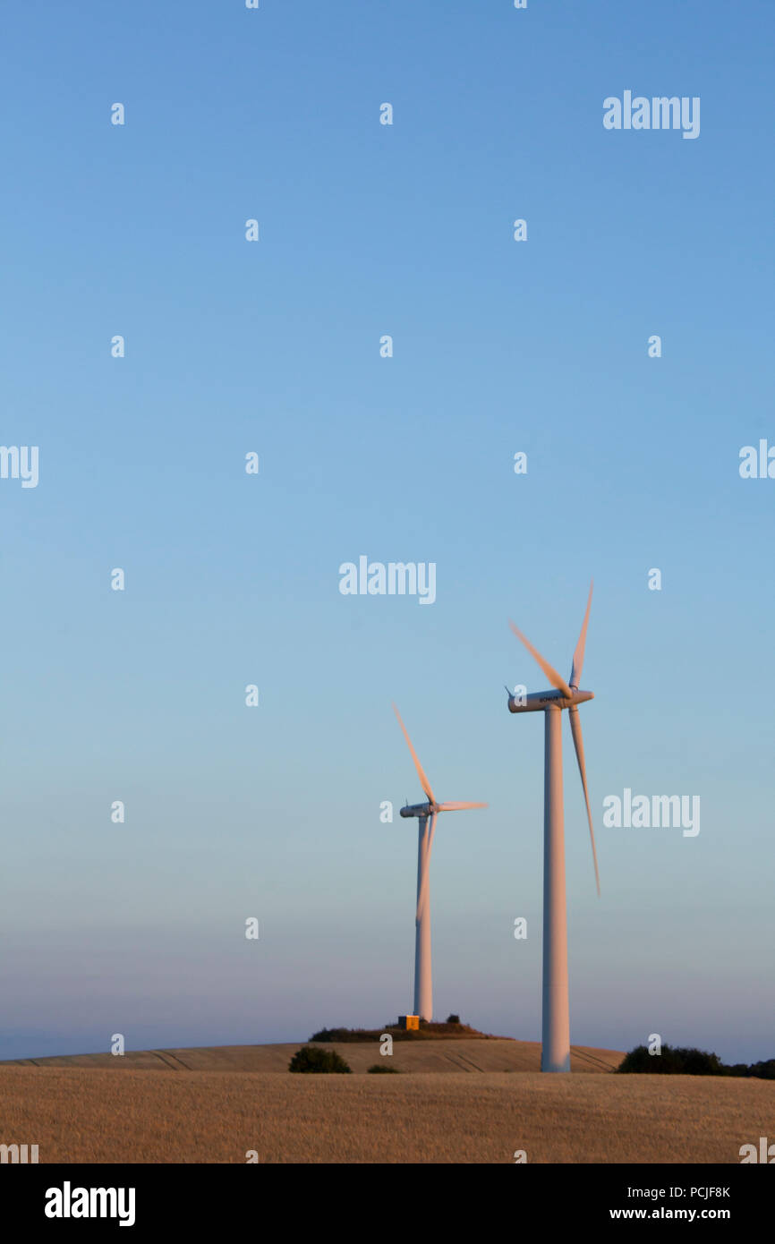 Wind turbines at a field for agriculture in the island of Jylland ...