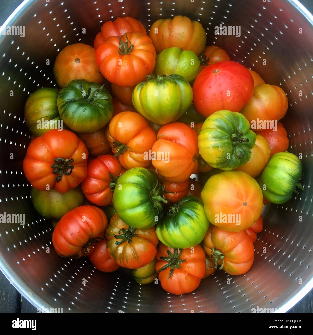 Tomato in colander hi-res stock photography and images - Alamy
