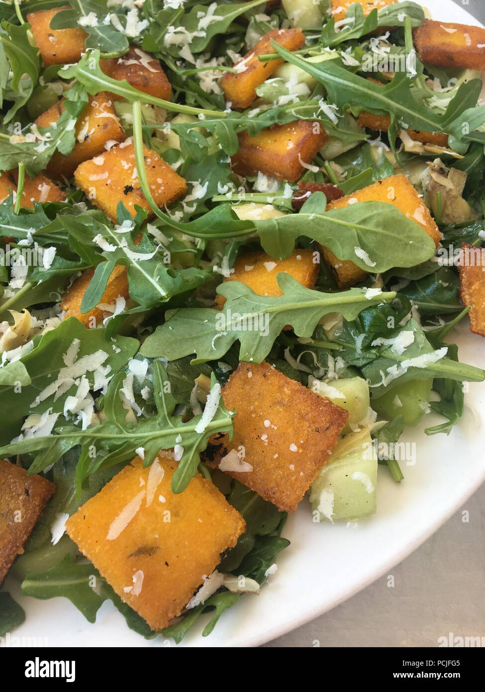 Rocket, parmesan and polenta salad Stock Photo - Alamy