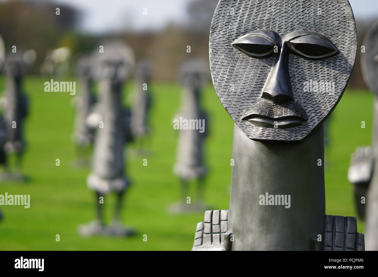 Statue or sculpture of weird faces in a garden, photo taken in ...