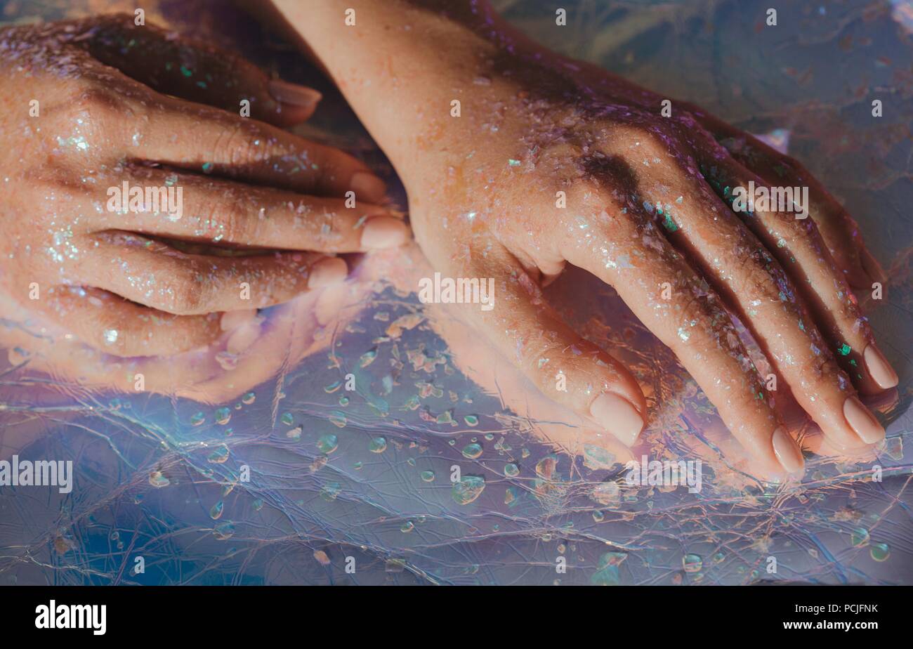 Human hands covered in glitter Stock Photo - Alamy