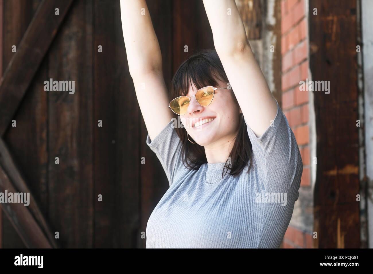 Person with arms raised hi-res stock photography and images - Alamy