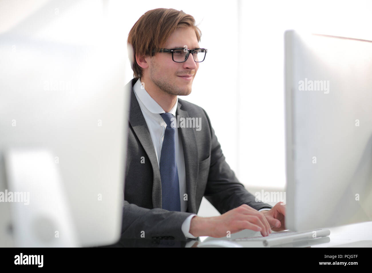 serious businessman typing text on a computer keyboard Stock Photo - Alamy