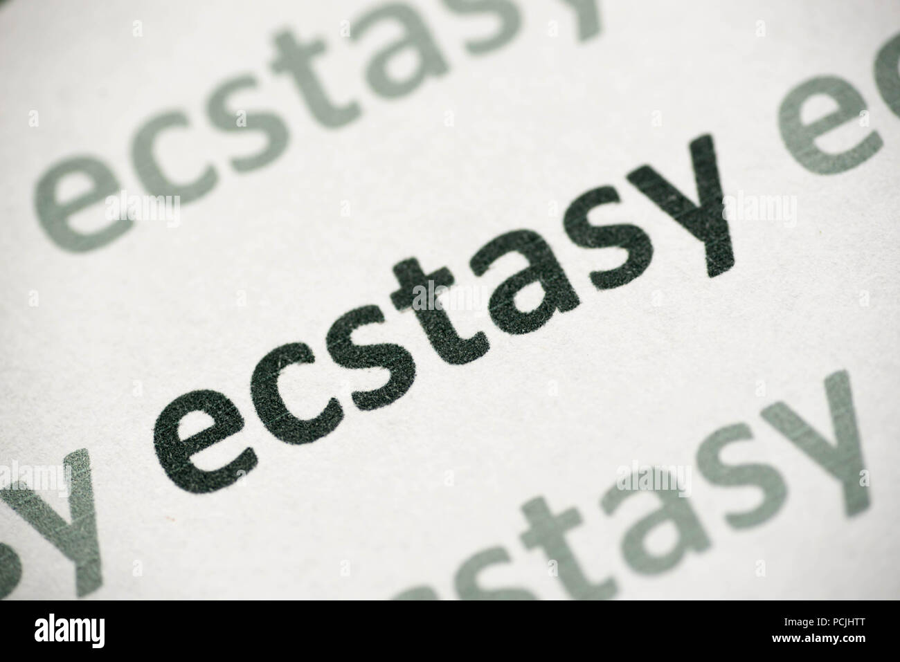 word ecstasy printed on white paper macro Stock Photo - Alamy