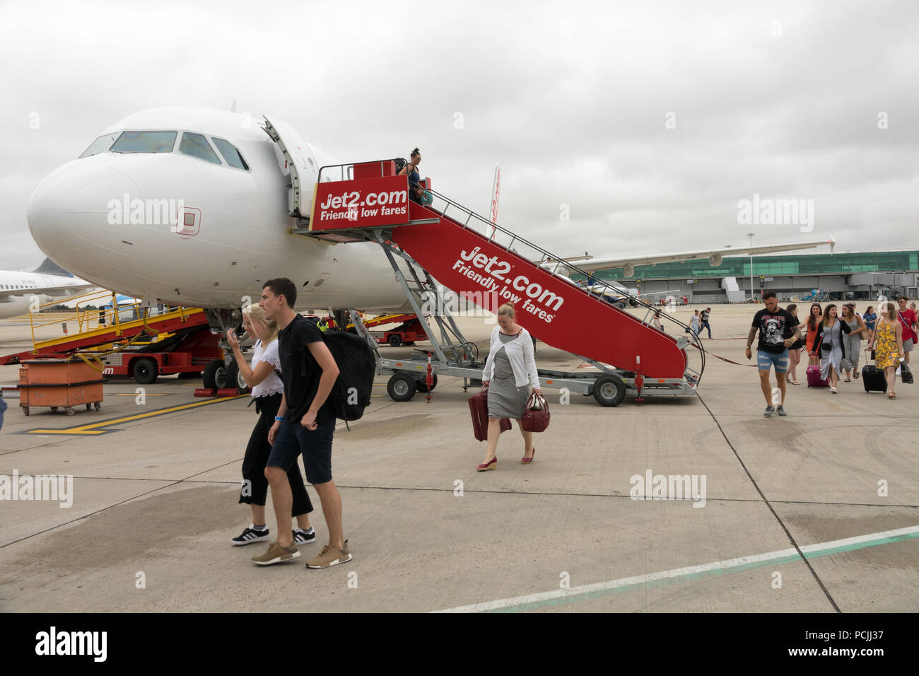 Passengers getting off an Jet2 plane at Stansted Airport,Essex Stock ...