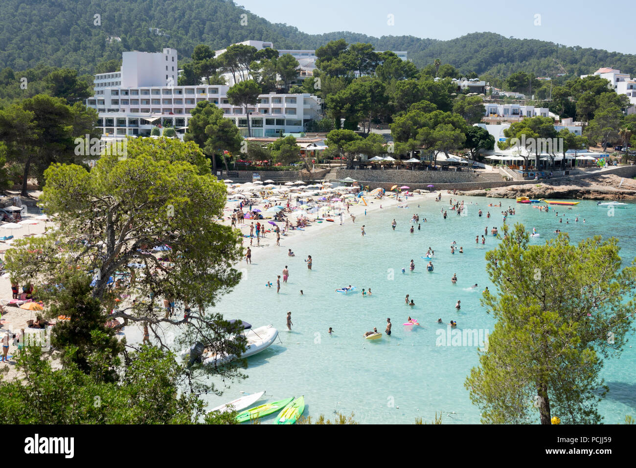 Visitors and holidaymakers in Portinatx in ibiza, Spain Stock Photo - Alamy