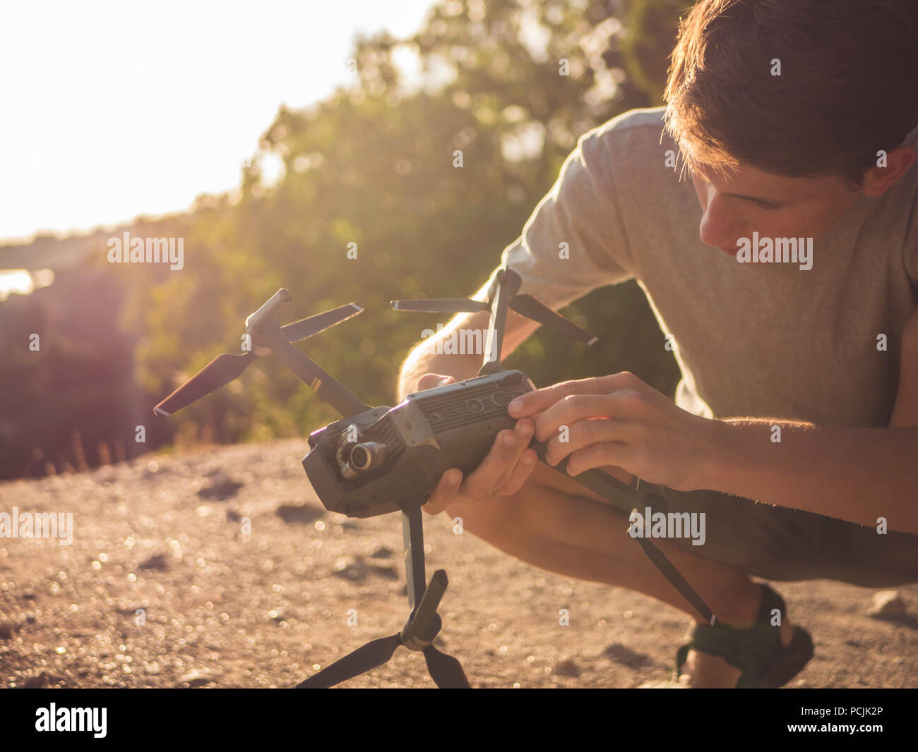 close up person adjusting the drone outdoor set up and take off close ...