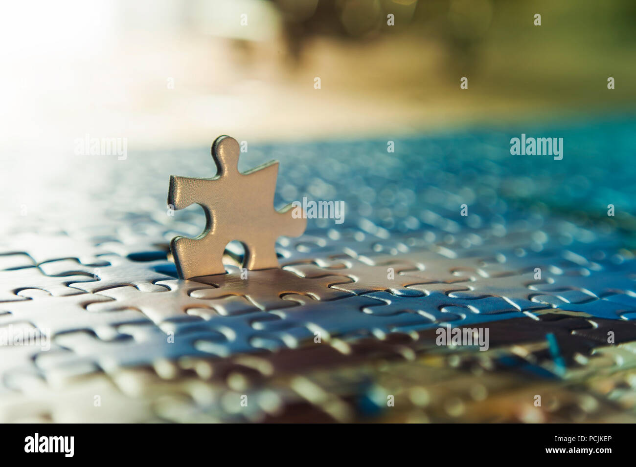 one puzzle piece stand out from the crowd Stock Photo - Alamy