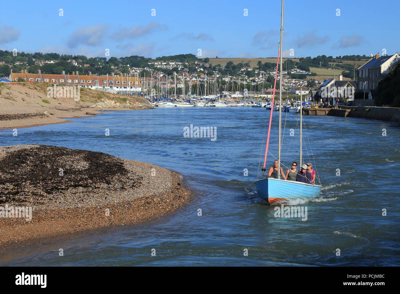 Boat at river Axe estuary near town of Seaton in East Devon Stock Photo ...