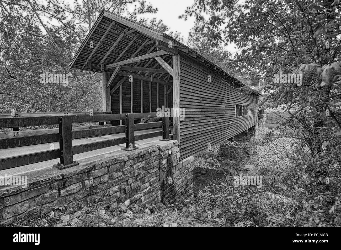 Covered wooden bridge Stock Photo - Alamy