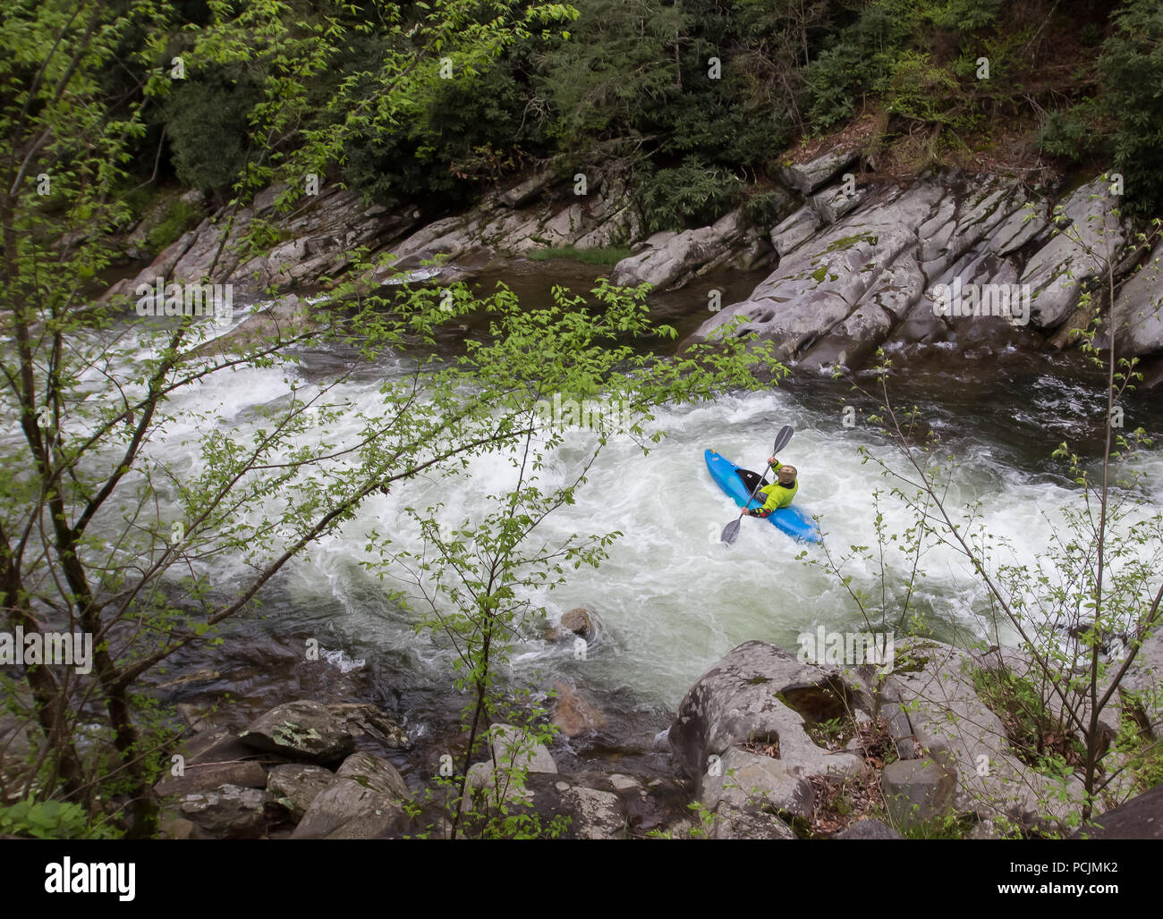 Kayaking down the rapids Stock Photo - Alamy