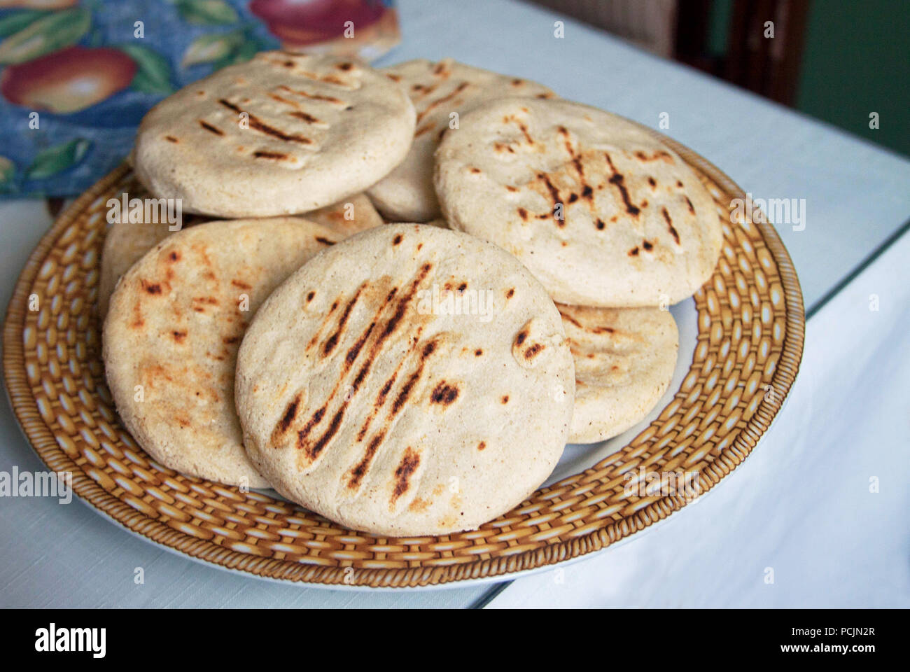 Arepas are is a type of food made of ground maize dough or cooked flour ...