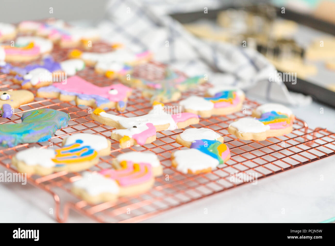 Unicorn shaped sugar cookies decorated by kids with royal icing on ...