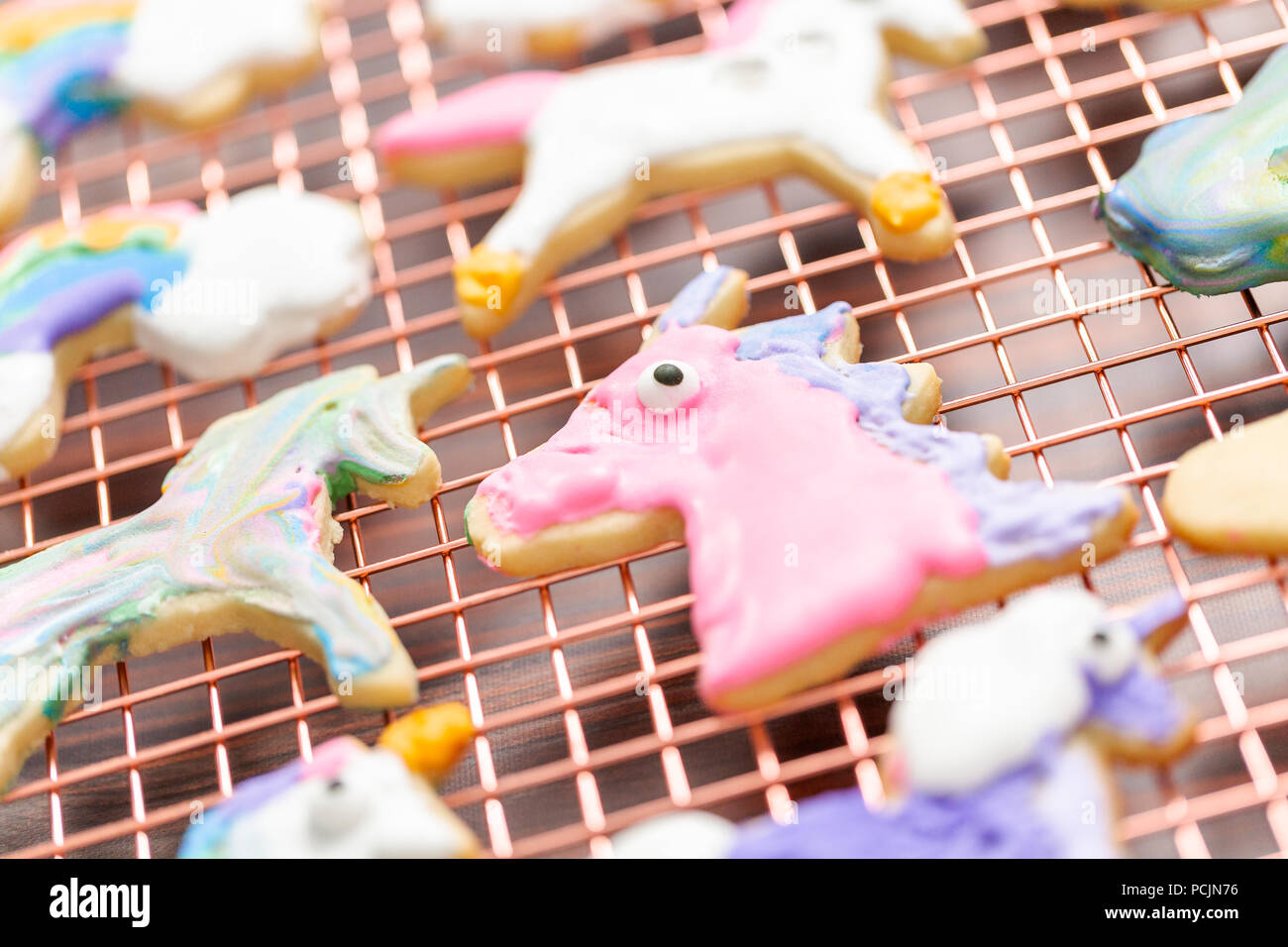 Unicorn shaped sugar cookies decorated by kids with royal icing on ...