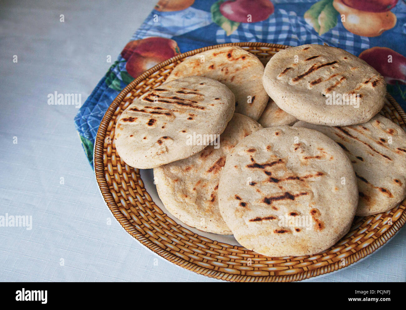 Arepas are is a type of food made of ground maize dough or cooked flour ...