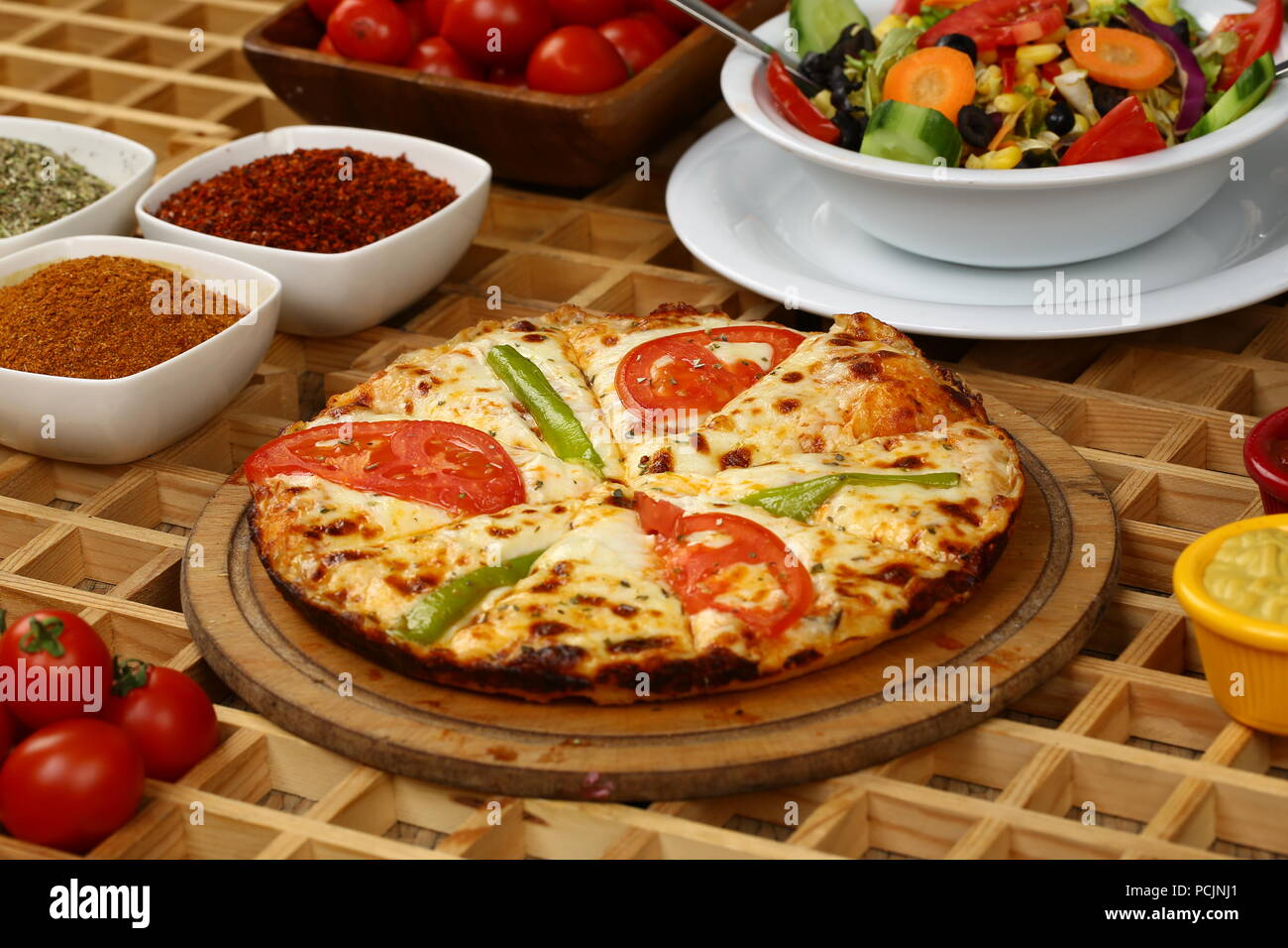 Fresh italian pizza with tomato and mozzarella cheese Stock Photo - Alamy