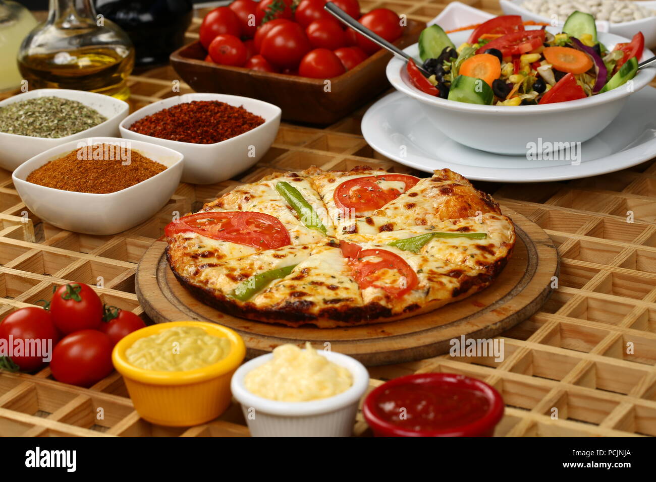 Fresh italian pizza with tomato and mozzarella cheese Stock Photo - Alamy