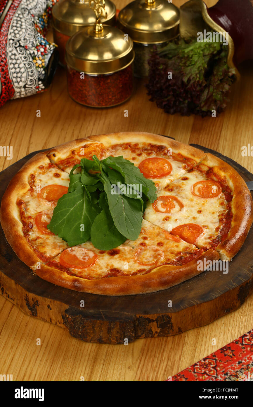 Fresh italian pizza with tomato and mozzarella cheese Stock Photo - Alamy